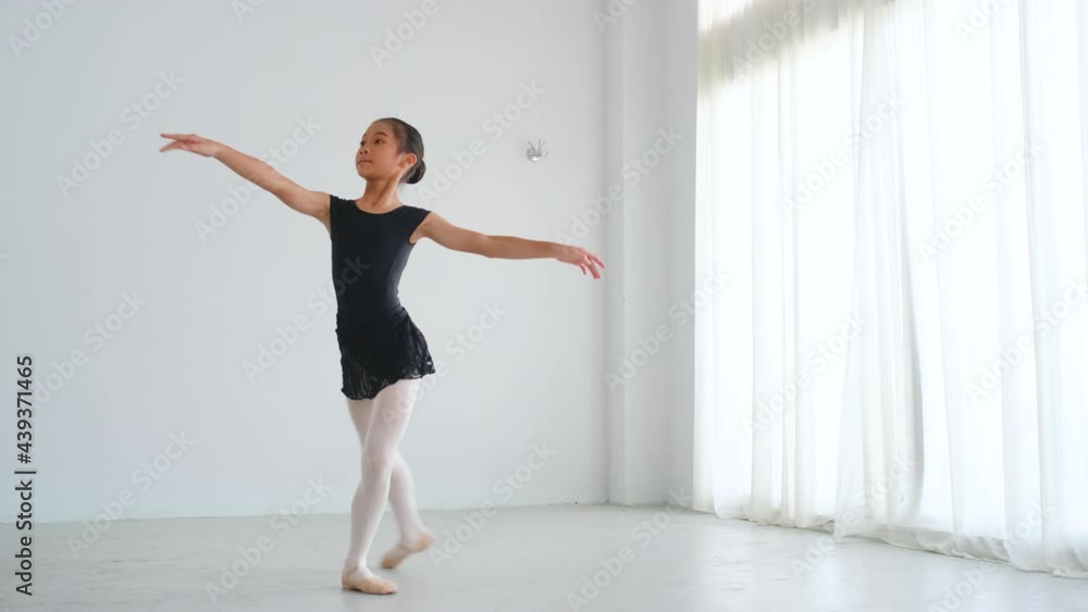 Asian ballet little girl stand and practice the dancing with raising ...