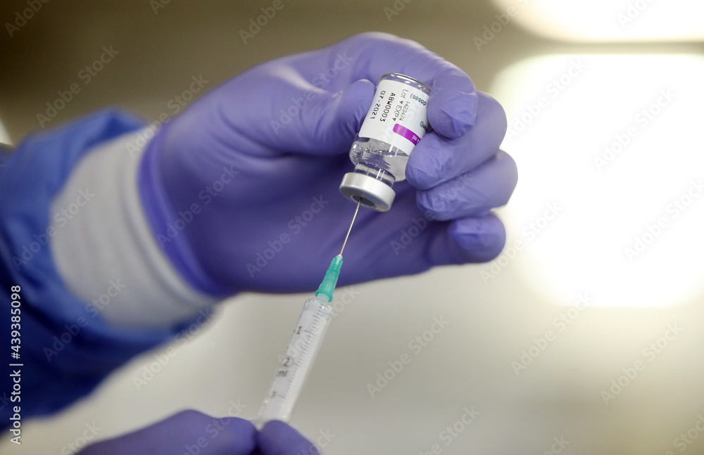 Medical worker holds needle and vaccination against coronavirus, COVID ...