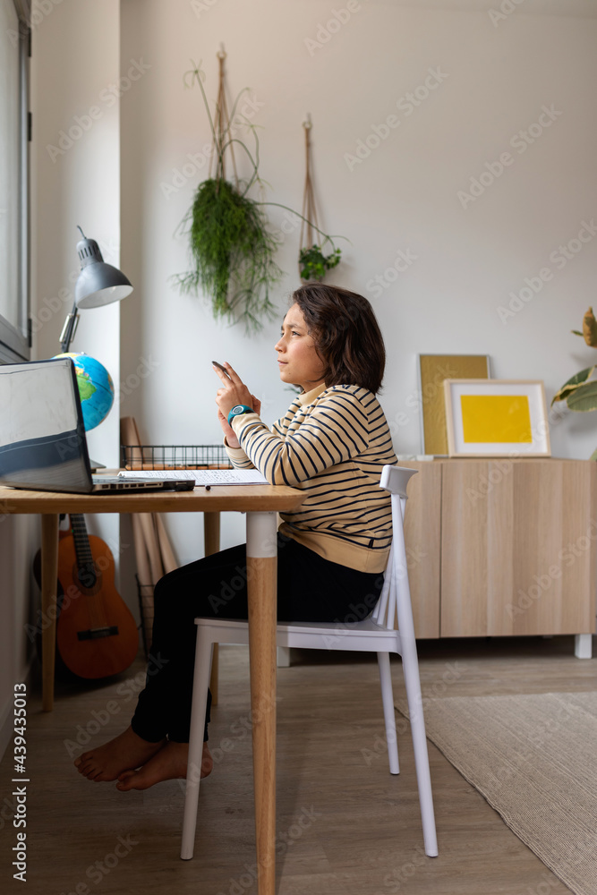 kid sitting on desk looking away Stock Photo | Adobe Stock