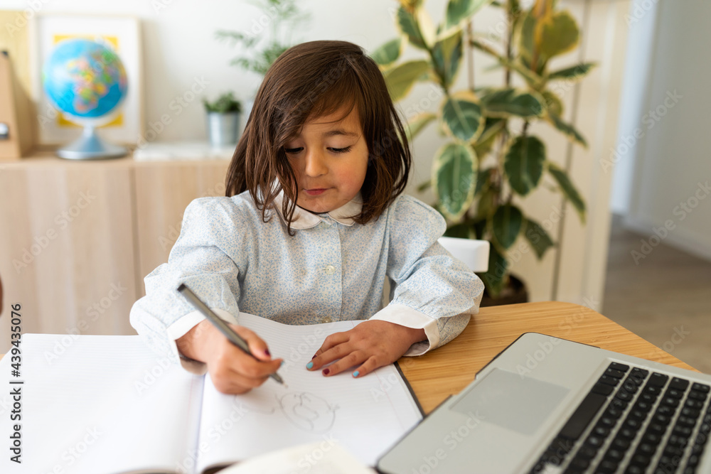 little girl sitting making a drawing Stock Photo | Adobe Stock