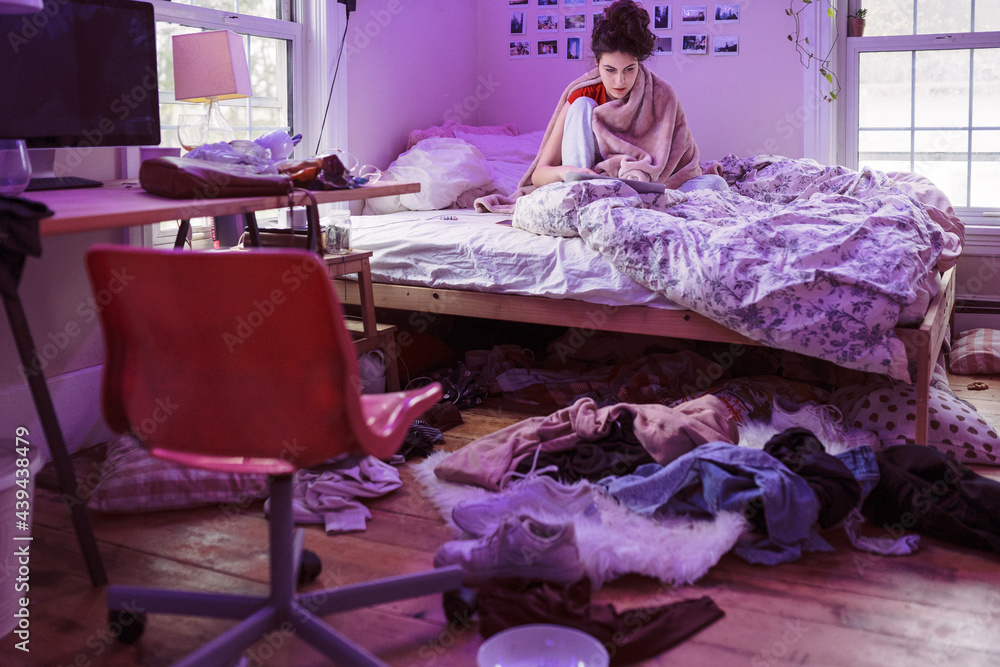 college student studying in messy room Stock Photo | Adobe Stock