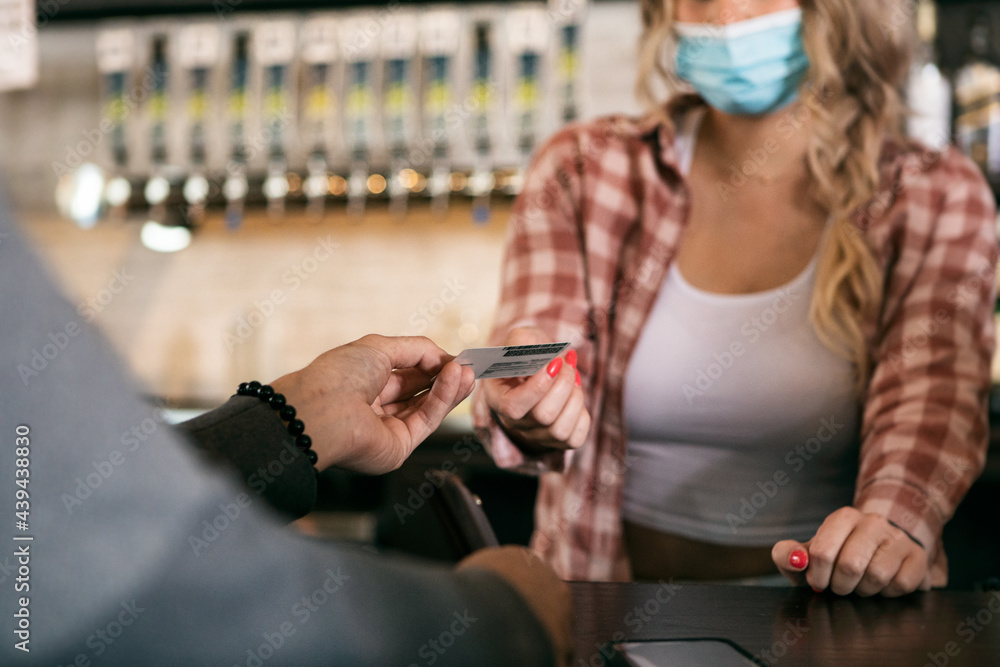 Brewery: Bartender Checks Identification Of Male Customer Stock Photo ...