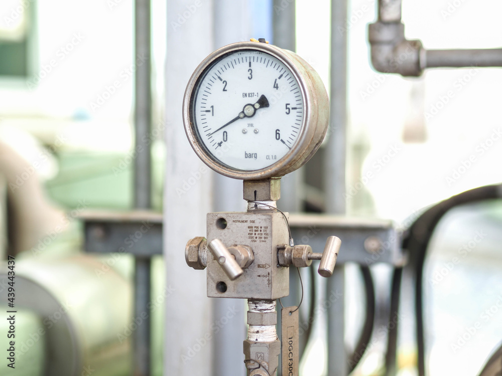 Pressure gauge of measuring instrument close up in industry zone at ...