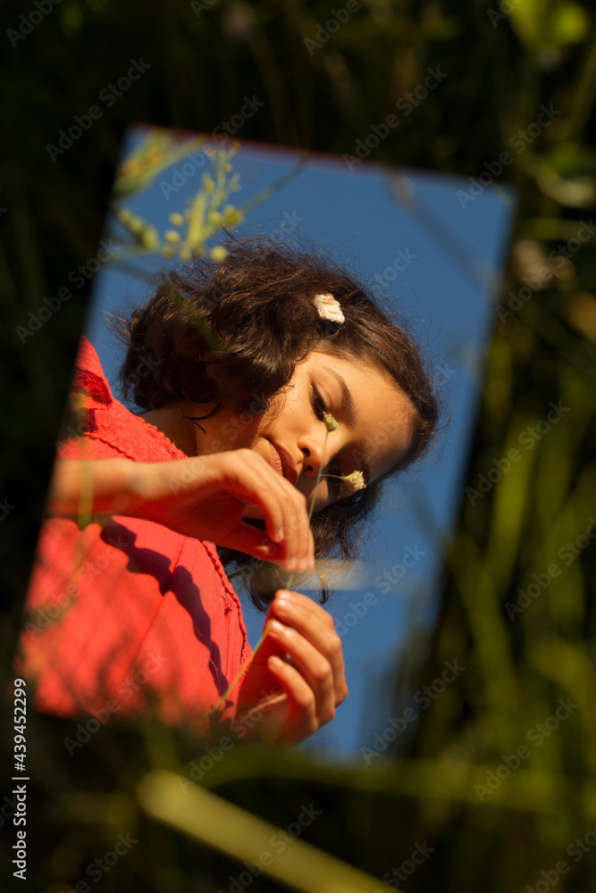 Reflection of a beautiful girl in a mirror Stock Photo | Adobe Stock