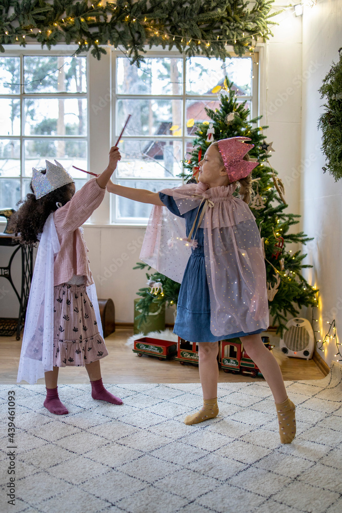 Two cute, little girls playing princesses Stock Photo | Adobe Stock