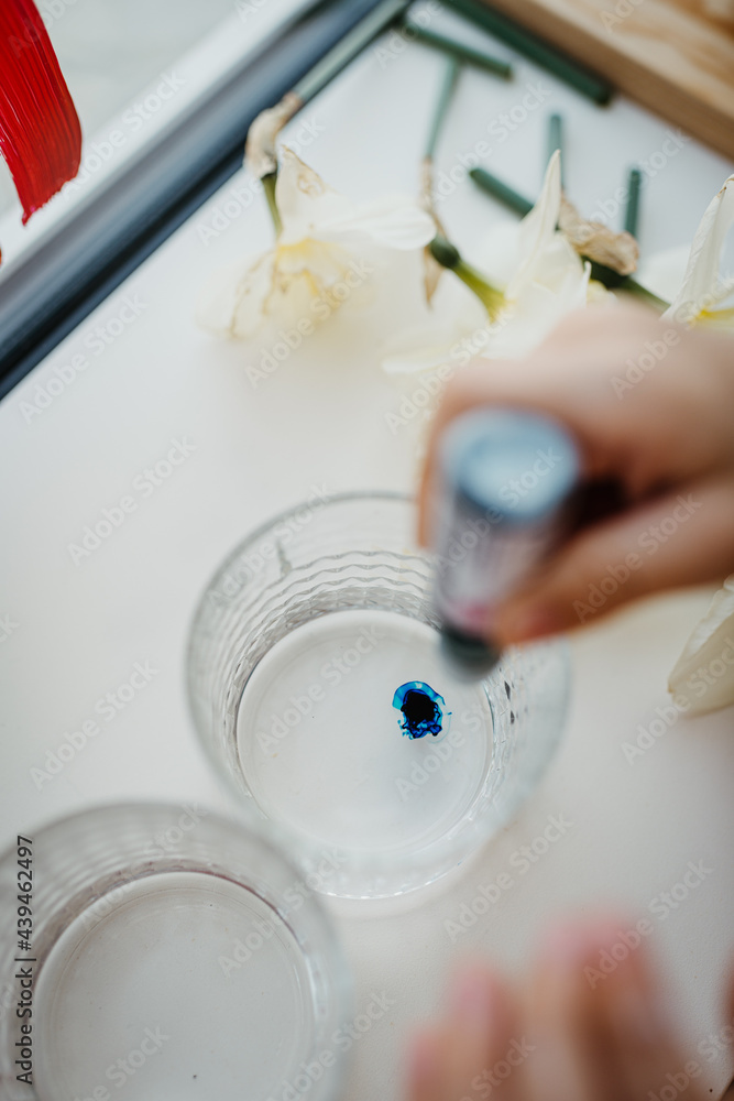 Mixing food coloring in water to make new colors Stock Photo | Adobe Stock