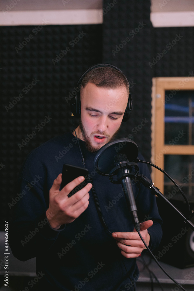 Professional musician working on song in recording studio Stock Photo ...
