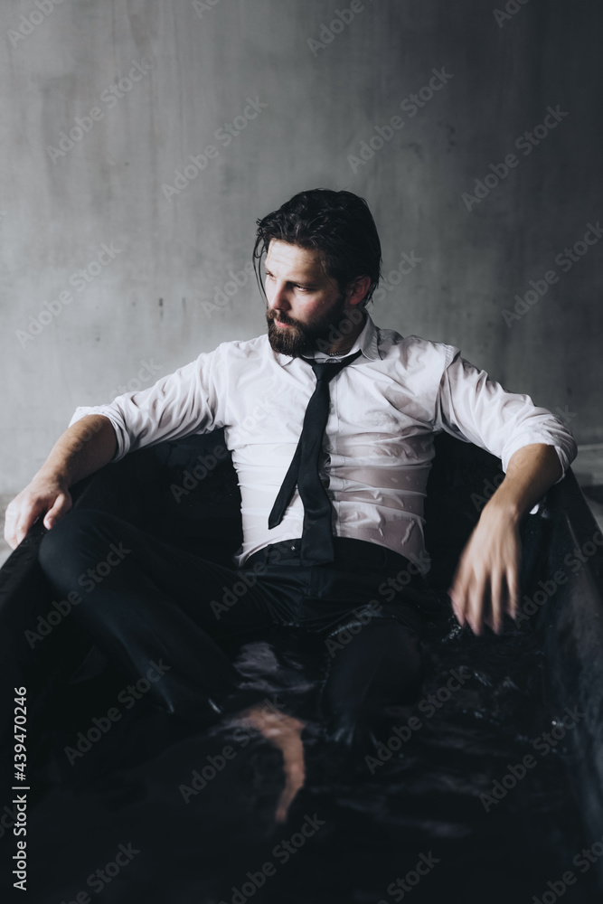 Wet male model in glamour outfit Stock Photo | Adobe Stock