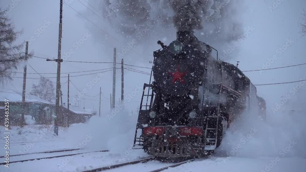Gimbal heavy snow blizzard old train steam locomotive rides in slow ...
