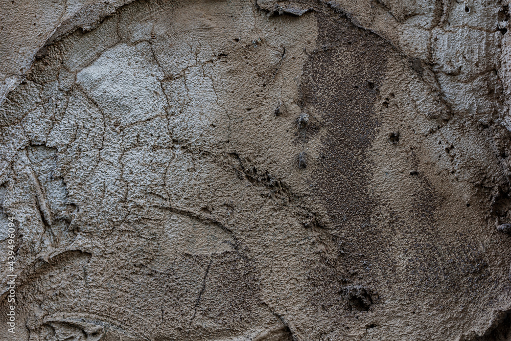 Foto de Grunge old rustic dirty mud wall of natural aged mortar. Uneven ...