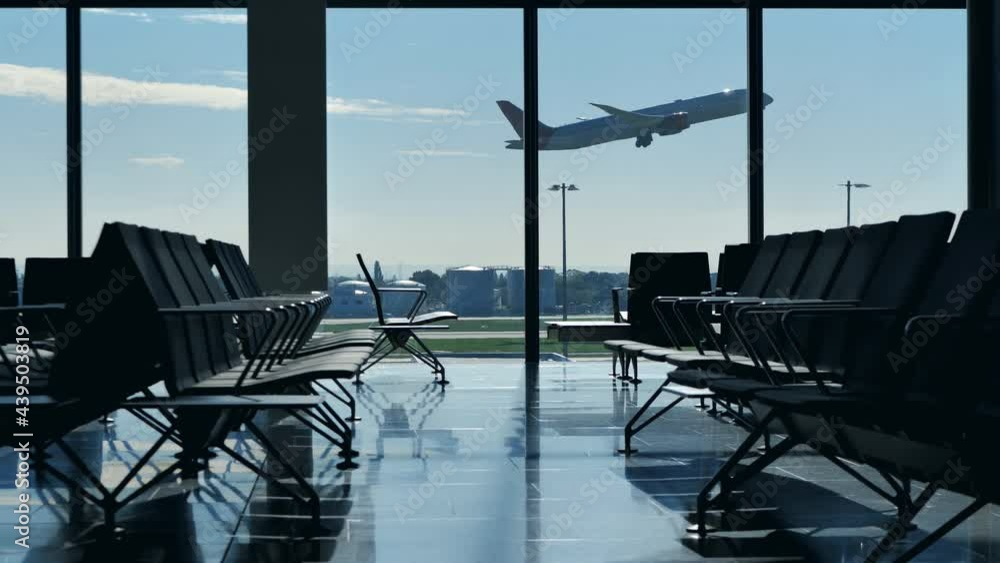 Airplane taking off seen through window. Blue sky view from inside an ...