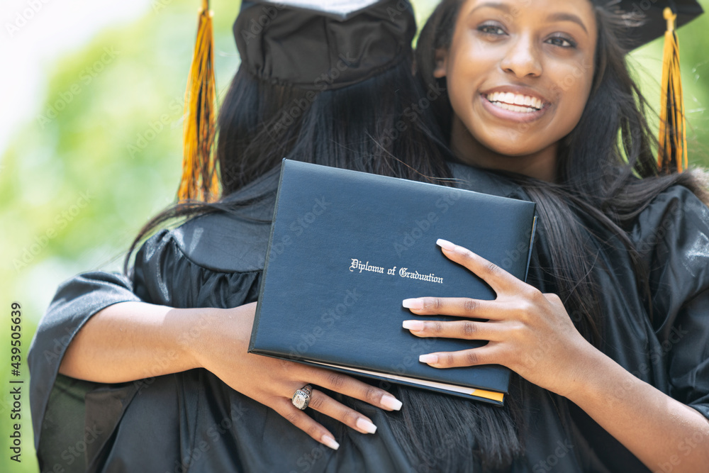 Grad: Friends Embrace After Graduating Stock Photo | Adobe Stock