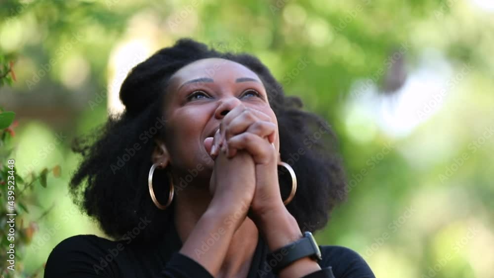 African woman praying to GOD feeling spiritual Stock Video | Adobe Stock