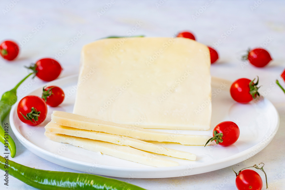 Old cheddar on a white plate. Sliced Cheddar Gruyere Cheddar. local ...