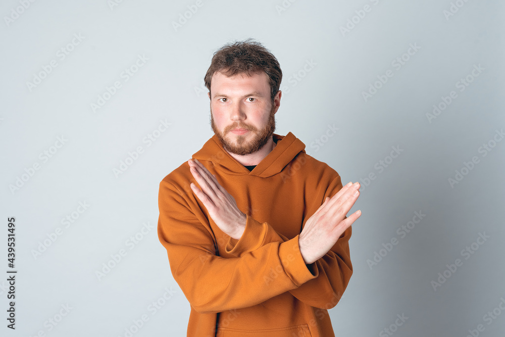 I said No. Handsome bearded man crossing arms in X sign, refusal stop ...