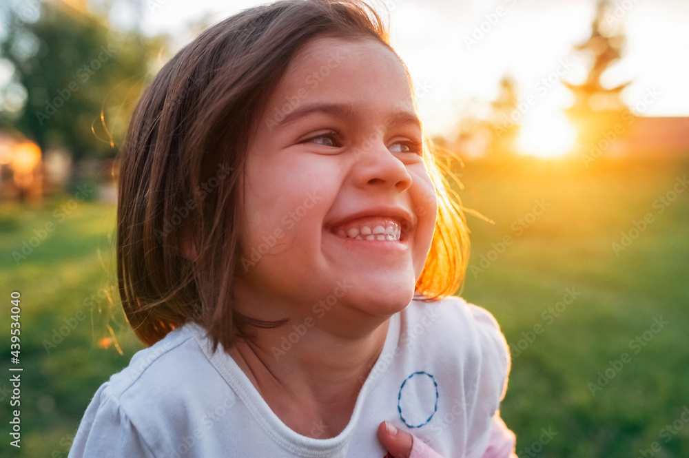 Girl giddy with excitment. Stock Photo | Adobe Stock