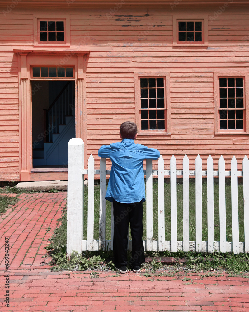 Boy Looking at Old House Stock Photo | Adobe Stock