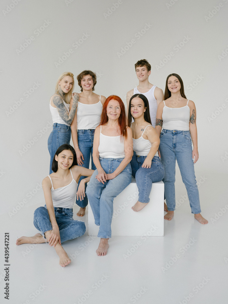 Group of diverse people in similar outfits in studio Stock Photo ...