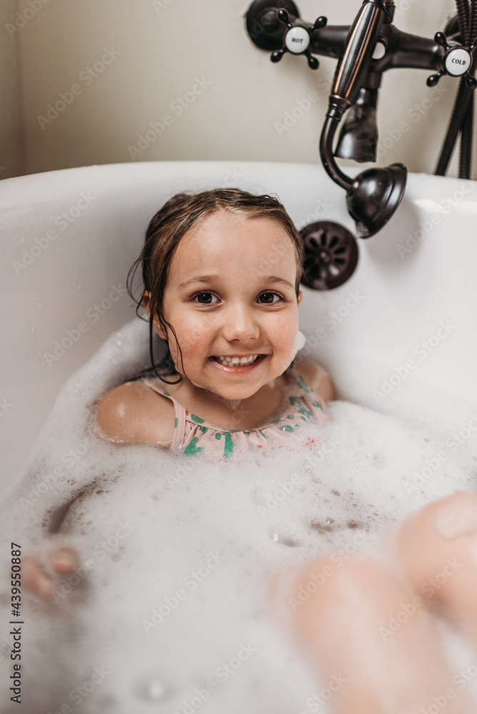 Adorable Girl Smiling In Tub Stock Photo Adobe Stock