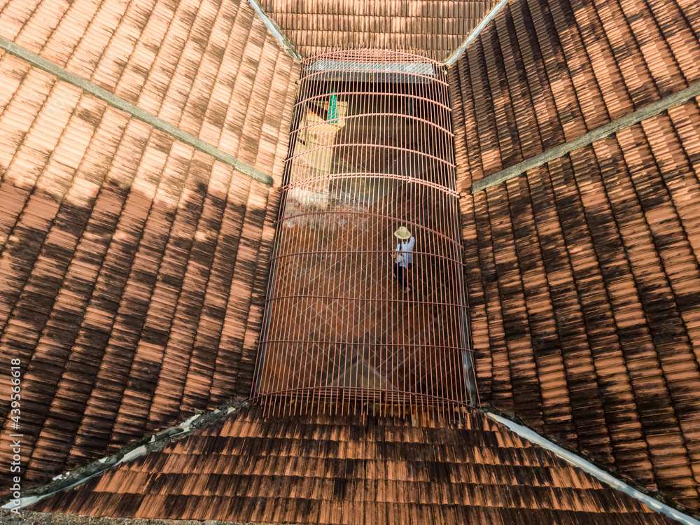 Slanted tiled roofs and balustrated of an old heritage house in a ...