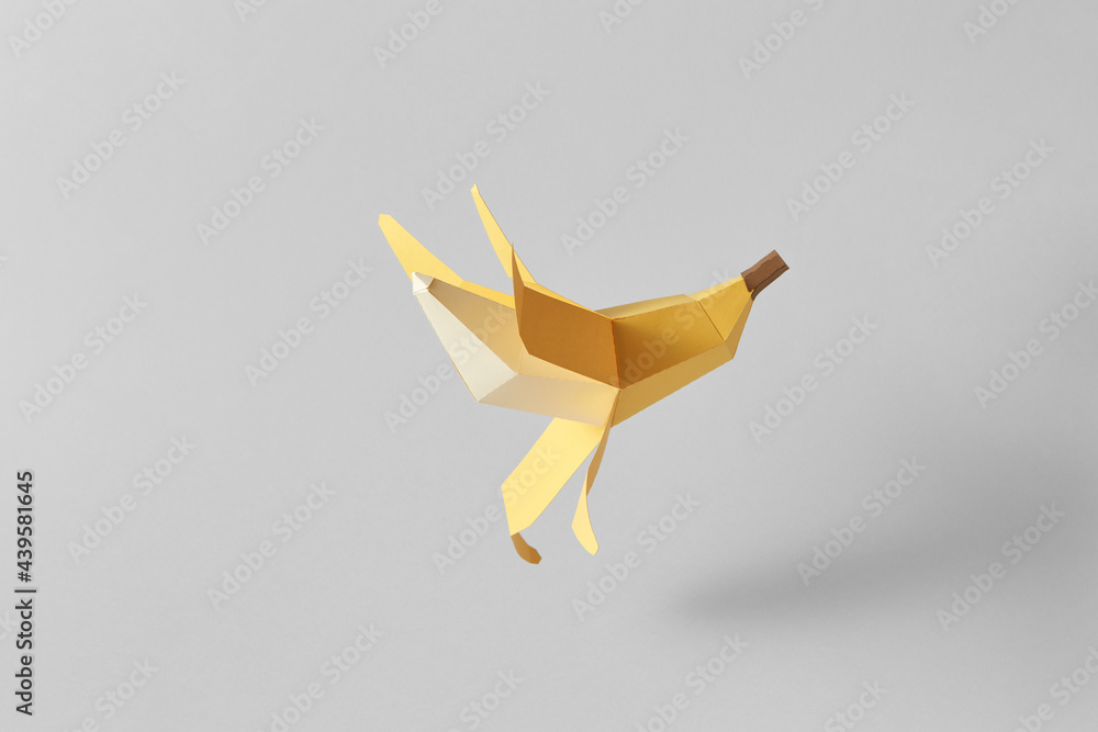 Papercraft yellow banana falling Stock Photo | Adobe Stock