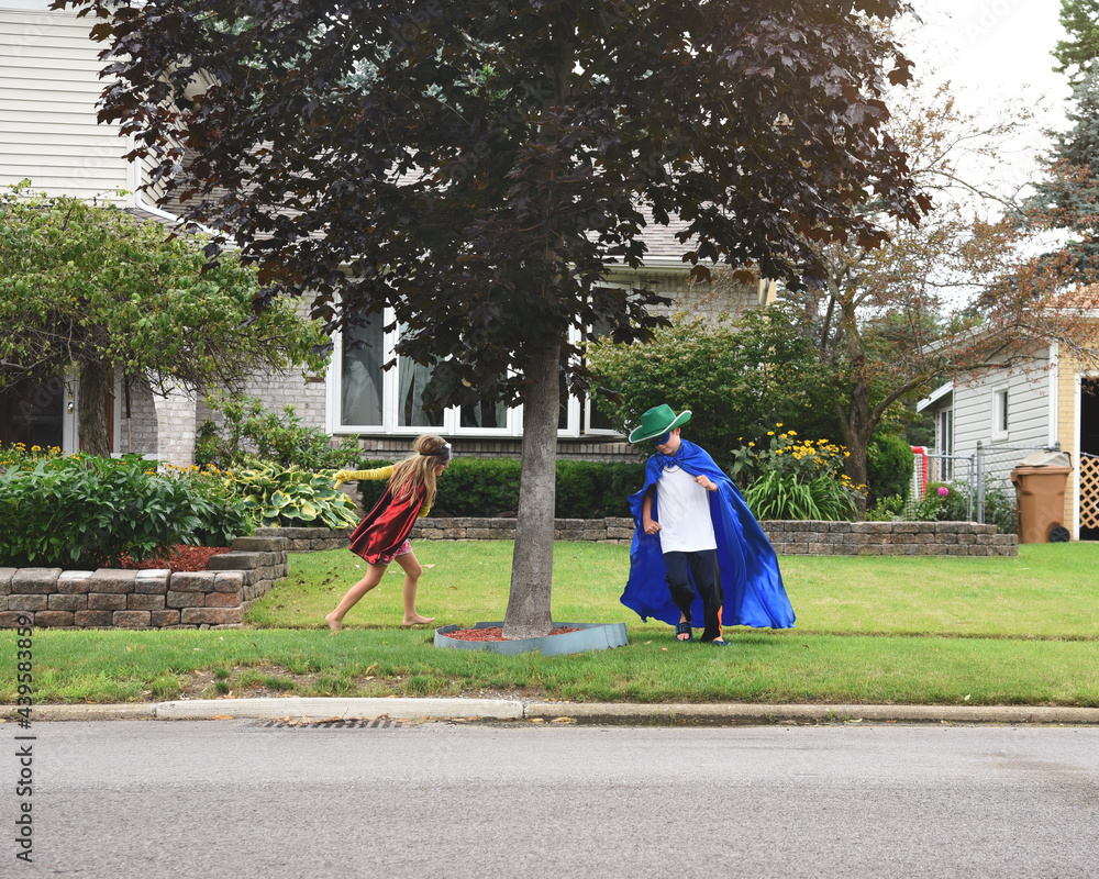 Super Hero Children Playing Outside Stock Photo | Adobe Stock