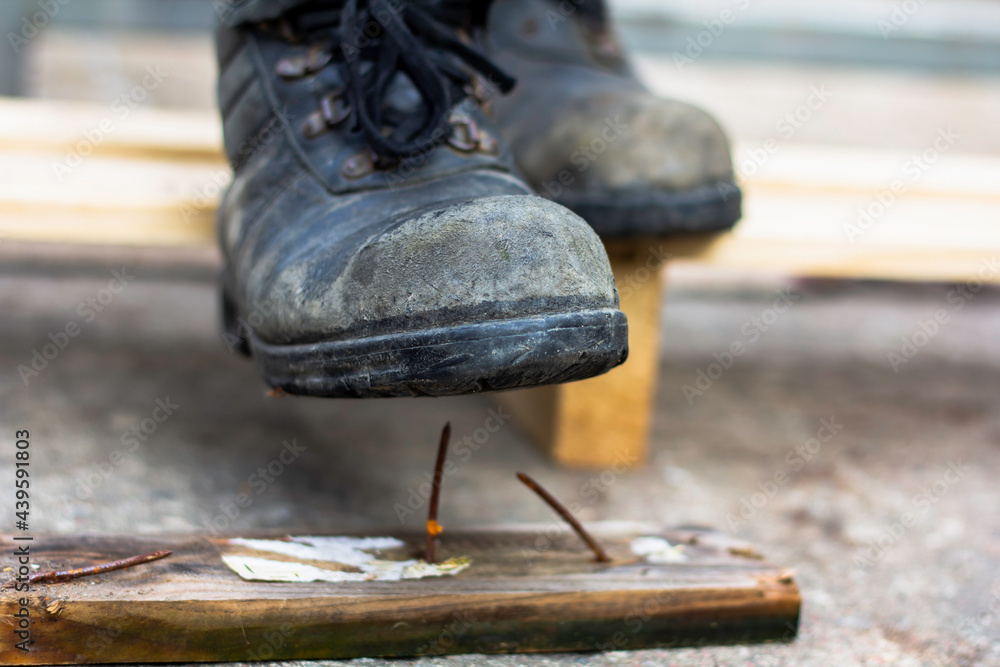 Wear safety shoes to ensure safety at work. construction workers wear ...