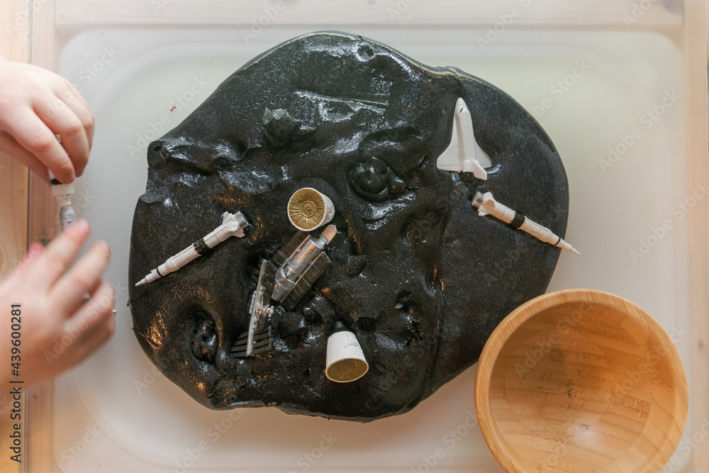 outer space themed sensory play with slime Stock Photo | Adobe Stock