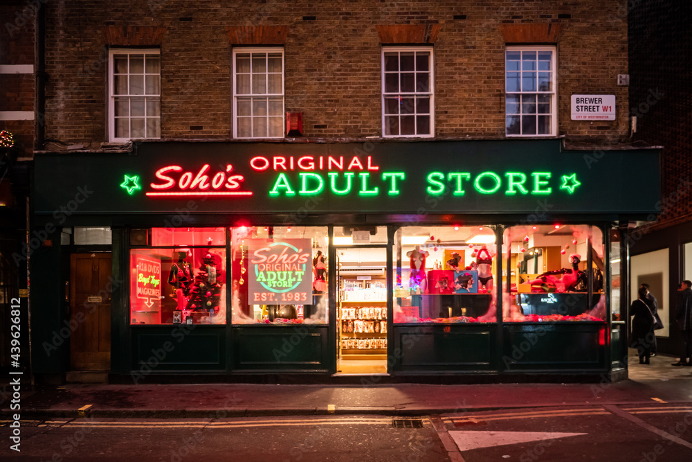 Adult Store, Soho, London. The neon lit façade and window display to an ...