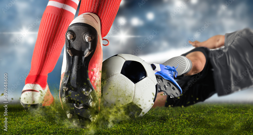 Soccer player making sliding tackle Stock Photo | Adobe Stock