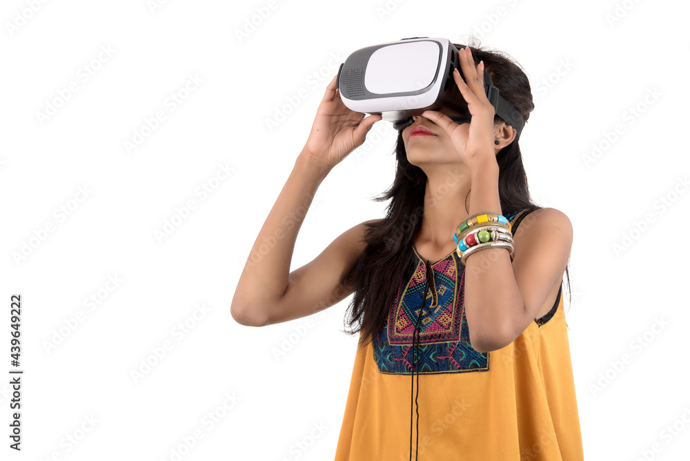 Beautiful girl looking though VR device. Young girl wearing virtual ...