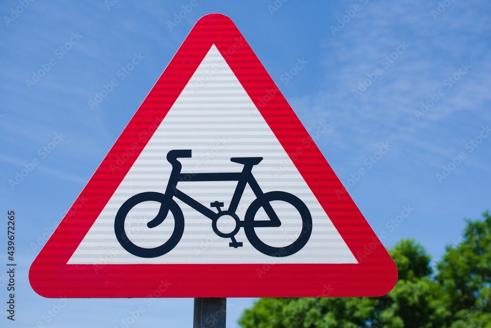 UK Warning symbol in a red triangle. Bicycle traffic sign.Cycle route ...