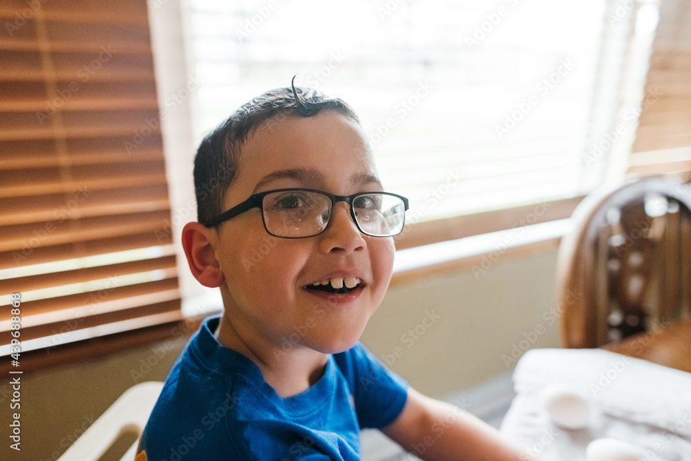 Happy boy smiling at the camera. Stock Photo | Adobe Stock