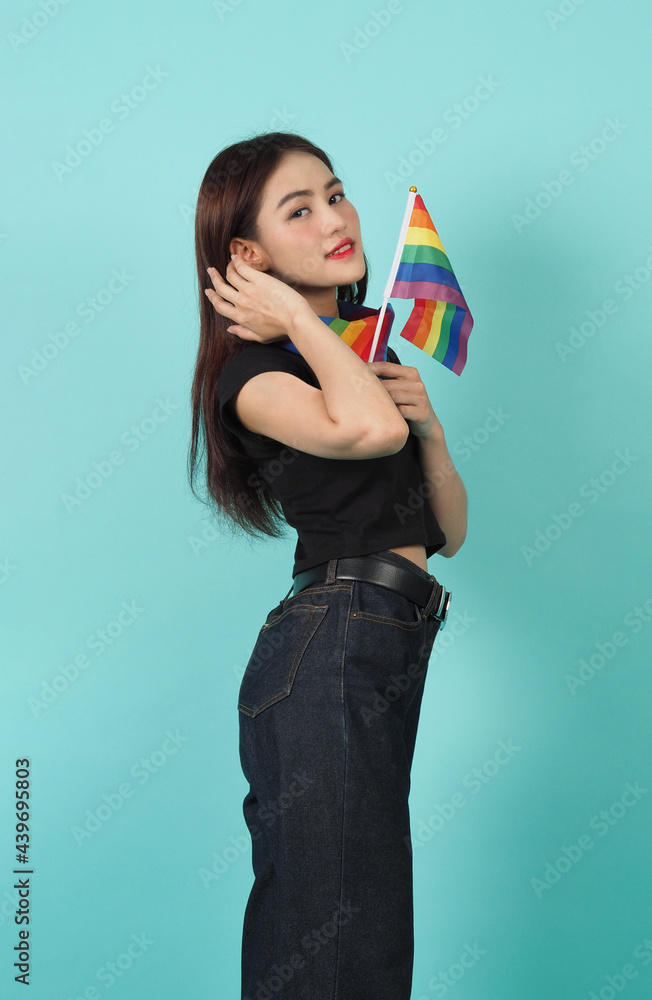 LGBTQ girl and pride flag. Sexy Lesbian girl and LGBTQ flag standing ...