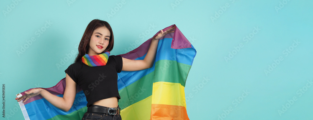 LGBTQ girl and pride flag. Sexy Lesbian girl and LGBTQ flag standing ...