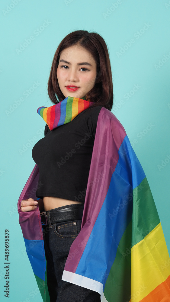 LGBTQ girl and pride flag. Sexy Lesbian girl and LGBTQ flag standing ...