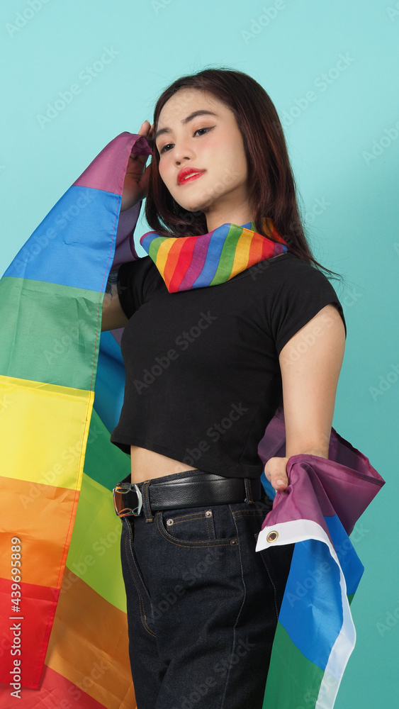 LGBTQ girl and pride flag. Sexy Lesbian girl and LGBTQ flag standing ...