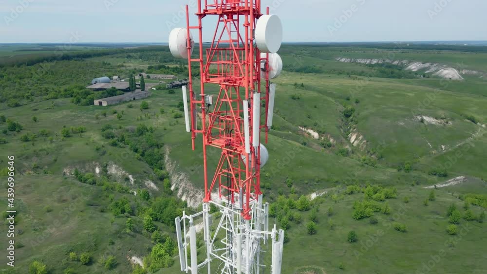 Orbit spiral aerial flight around Telecommunication antenna tower with 5G and 4G base network ...