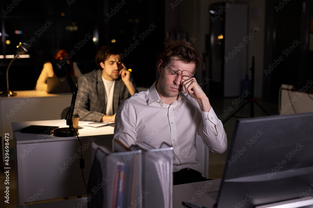 Fotografia do Stock: eyes of young male office worker hurt from ...