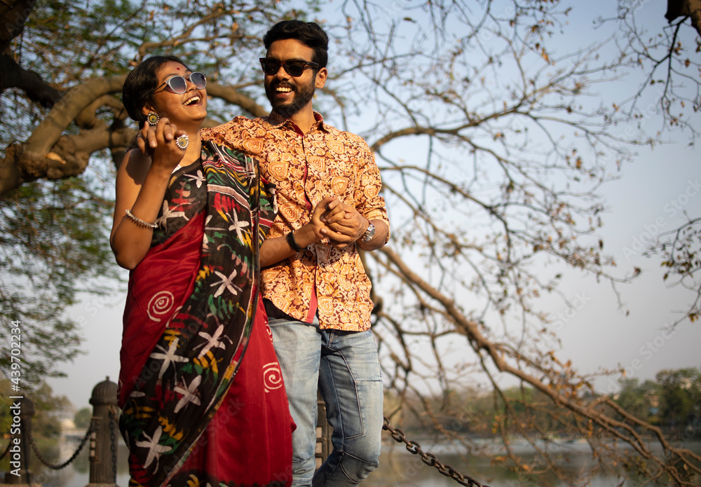 Young Indian couple making conversation and interacting with each other ...