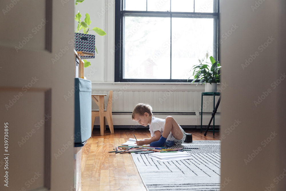 Little boy drawing in his room on the floor Stock Photo | Adobe Stock
