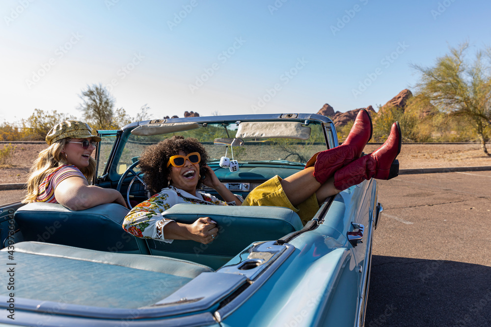 Happy Friends Talking in Vintage car on road trip Stock Photo | Adobe Stock