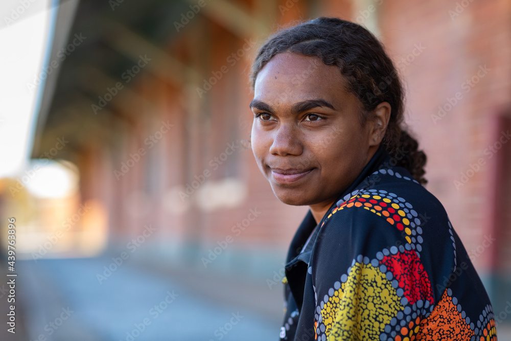 head and shoulders of young aboriginal woman with hair tied back Stock ...