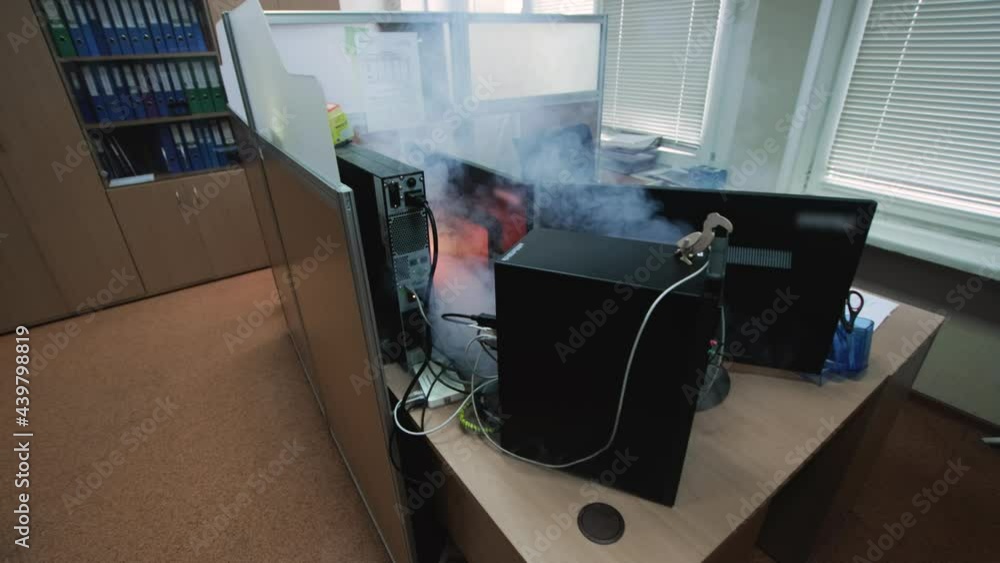 Smoke from computer inside office before fire of electronics ...