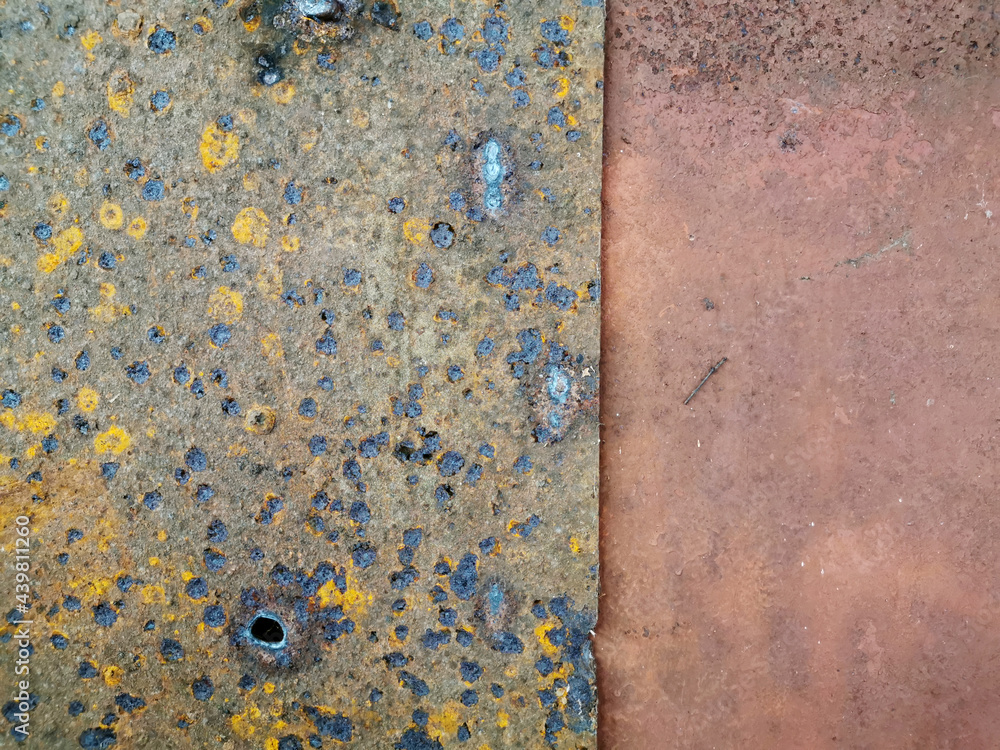 texture of old metal plates lying on top of each other and exposed to ...