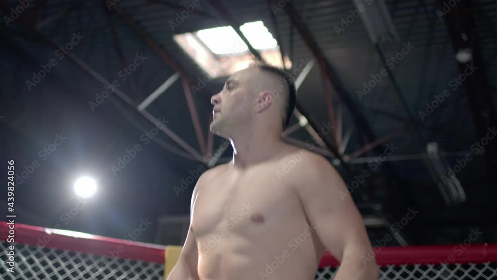 Muscular MMA fighter is inroducing himself inside the octagon and ...