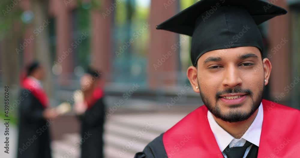 Young graduated boy holding his graduation degree convocation ceremony ...