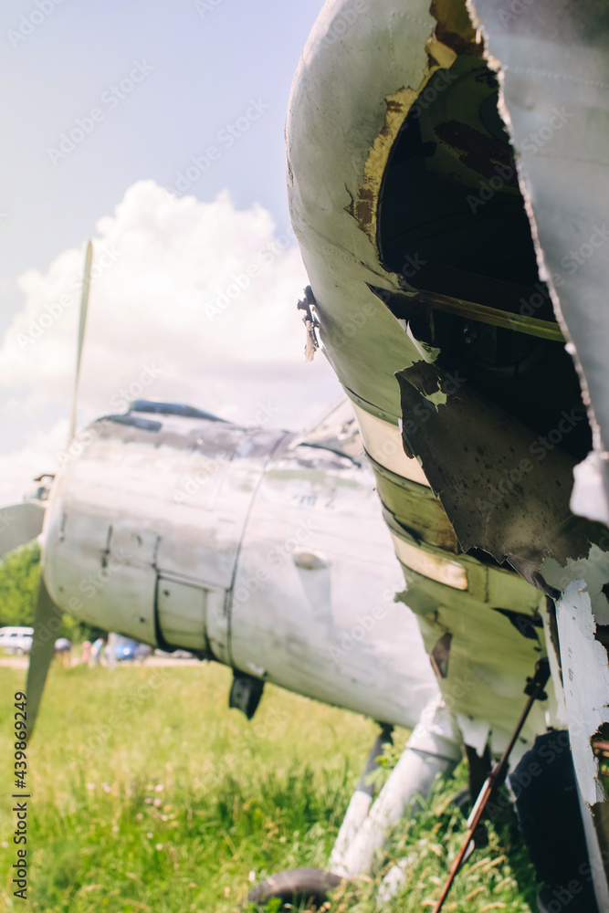 A close-up of an old wrecked passenger plane that has been ...