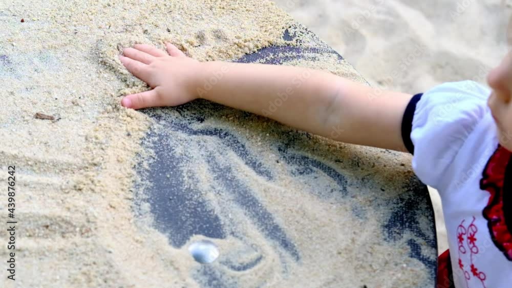 Video Stock child plays in summer with sand on seashore, in the sandbox ...