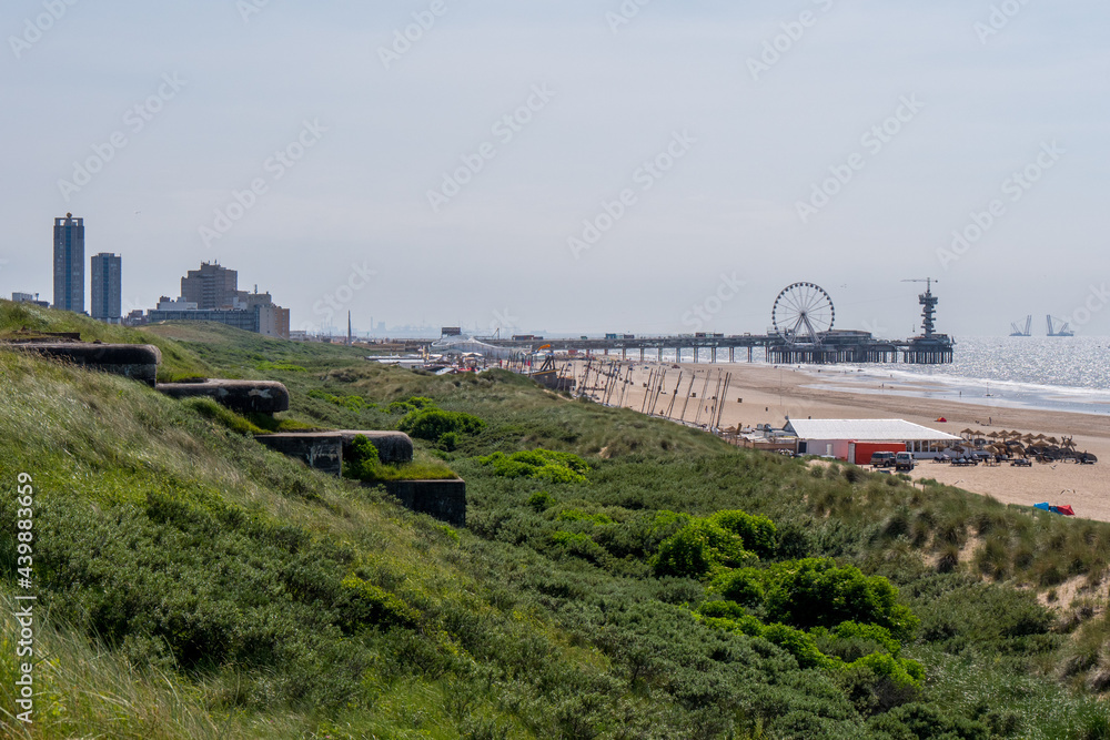The dunes of Wassenaar with a WW2 bunker on the left and the pier ...